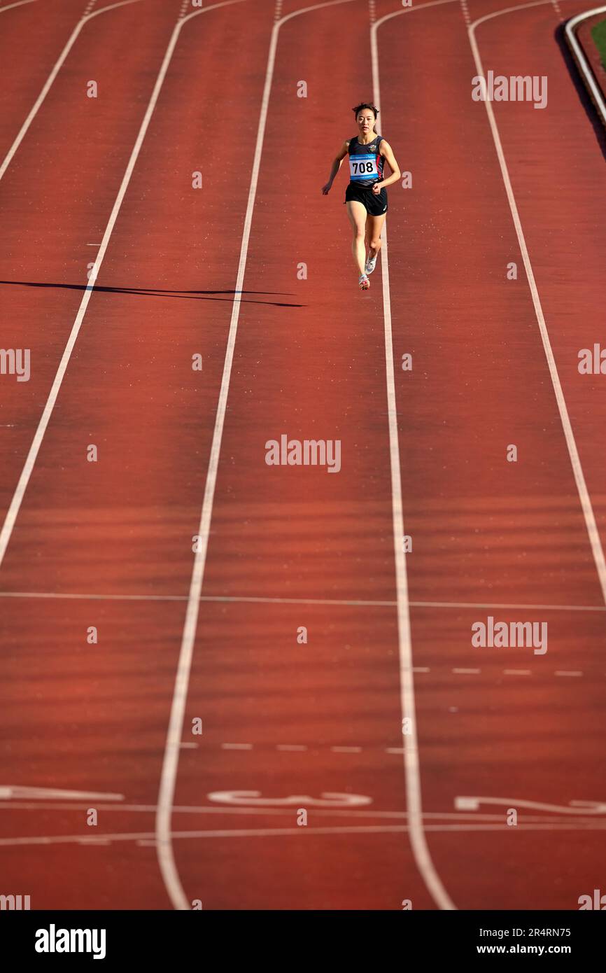 Japanese athletes running on track Stock Photo - Alamy