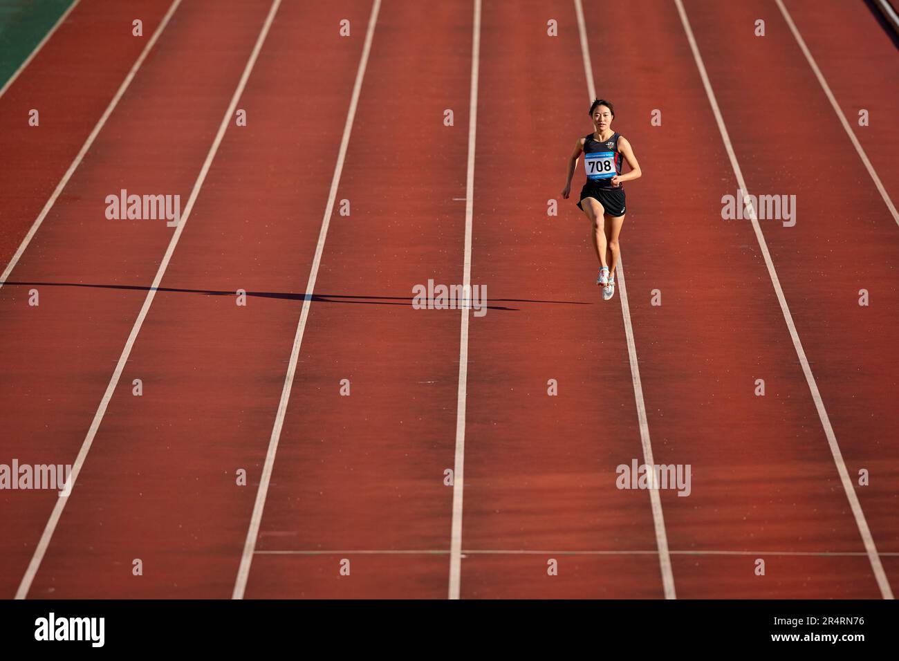 Japanese athletes running on track Stock Photo - Alamy
