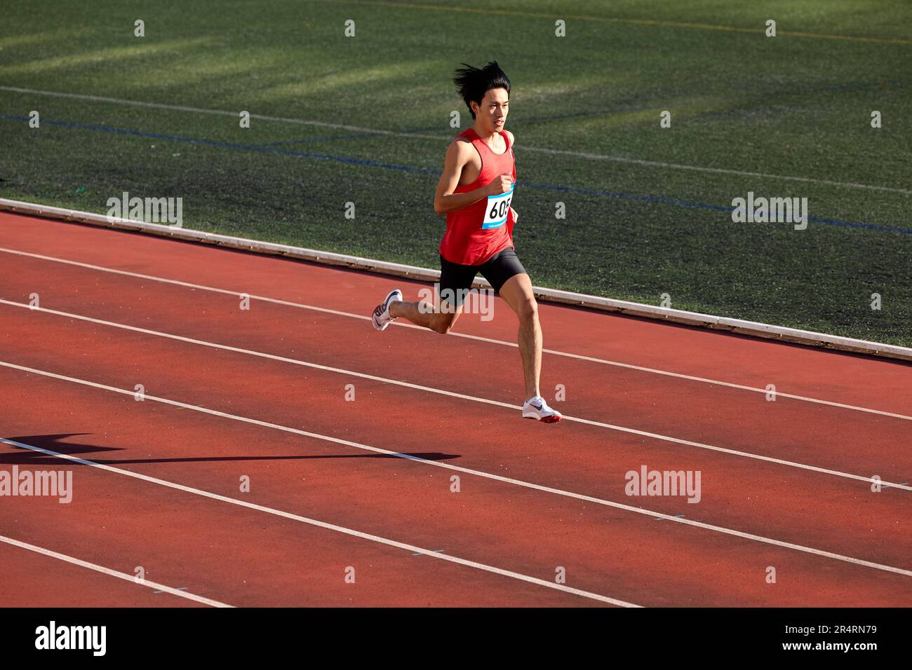 Japanese athletes running on track Stock Photo - Alamy