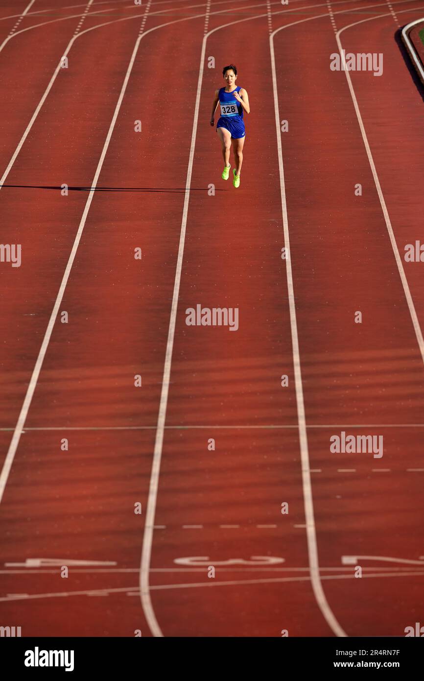 Japanese athletes running on track Stock Photo - Alamy