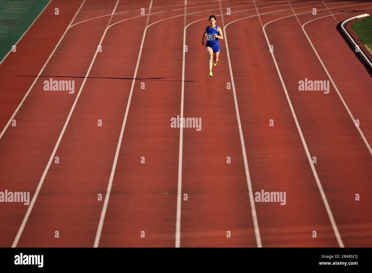 Japanese athletes running on track Stock Photo - Alamy