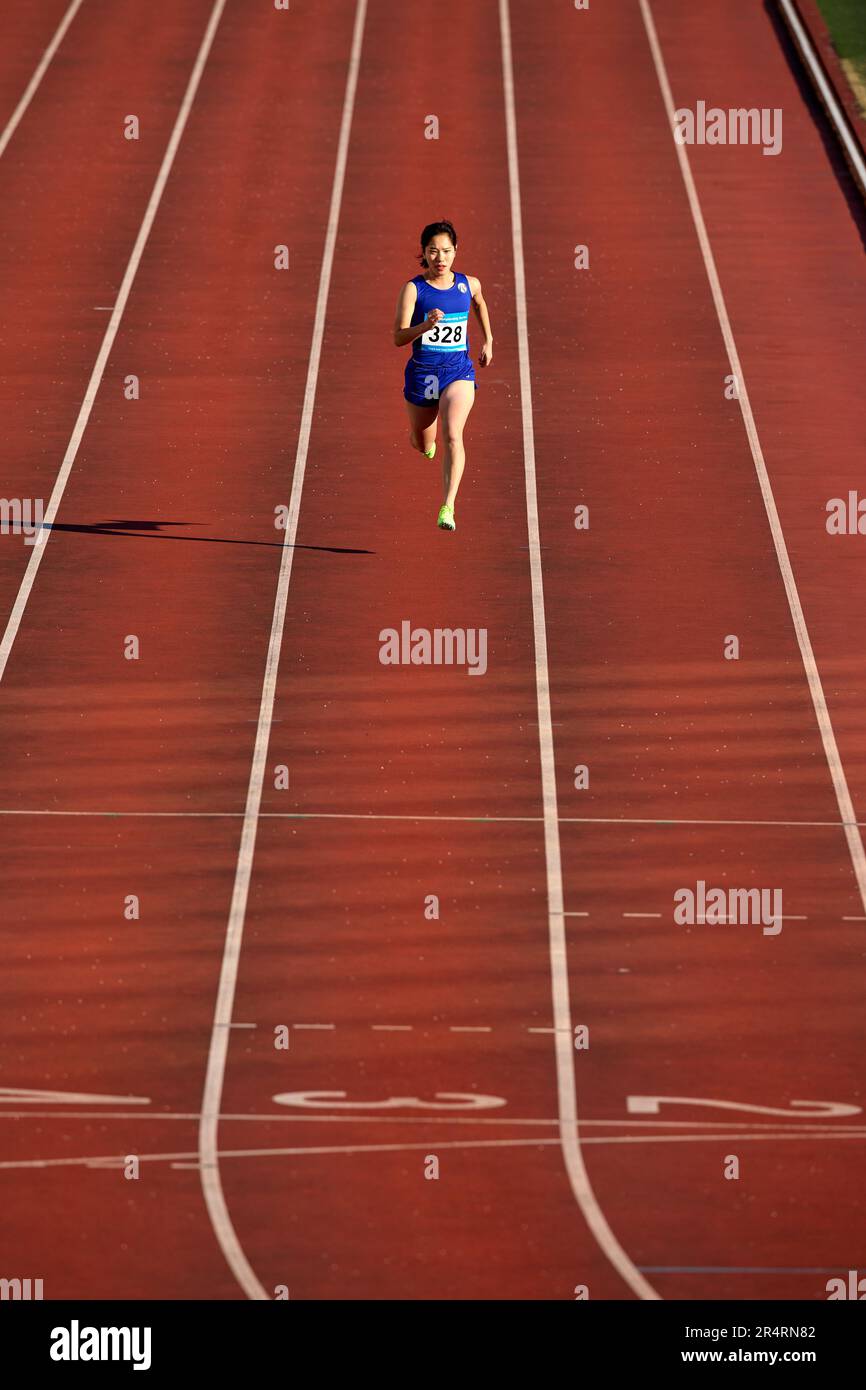 Japanese athletes running on track Stock Photo - Alamy