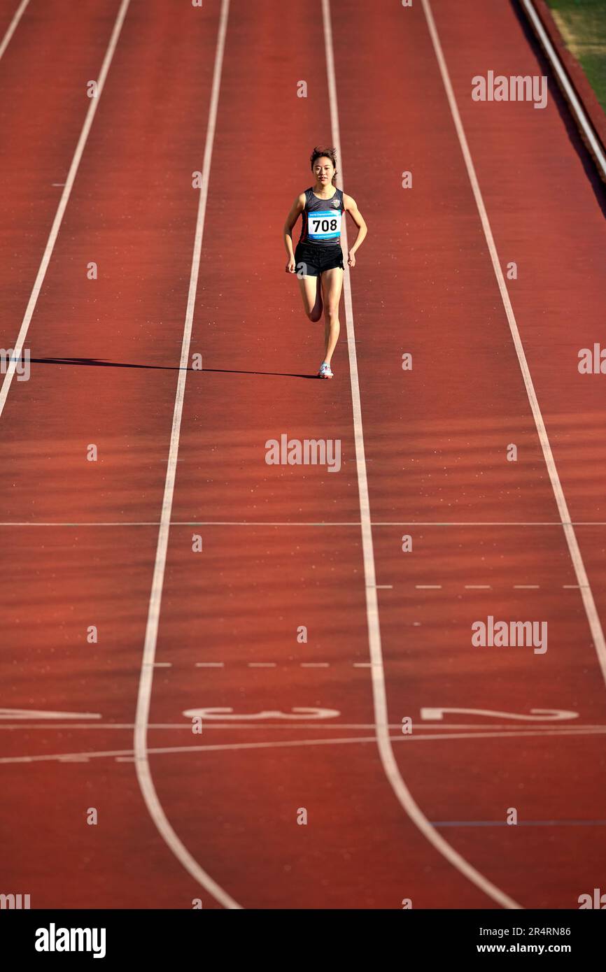 Japanese athletes running on track Stock Photo - Alamy