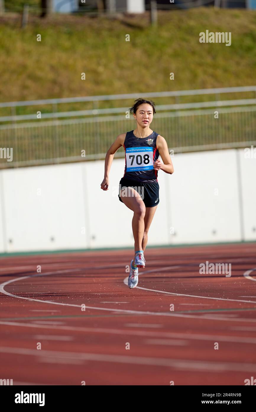 Japanese athletes running on track Stock Photo - Alamy