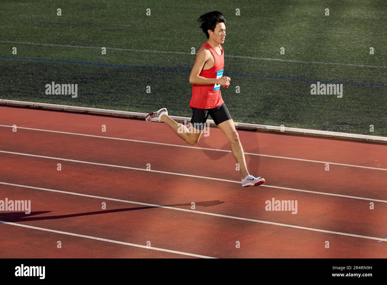Japanese athletes running on track Stock Photo - Alamy