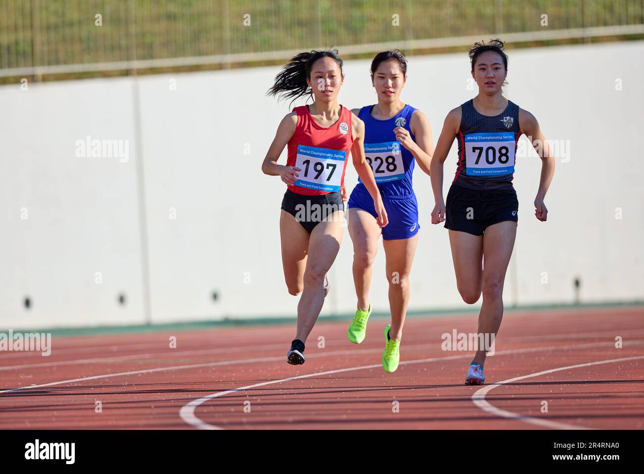 Japanese athletes running on track Stock Photo - Alamy