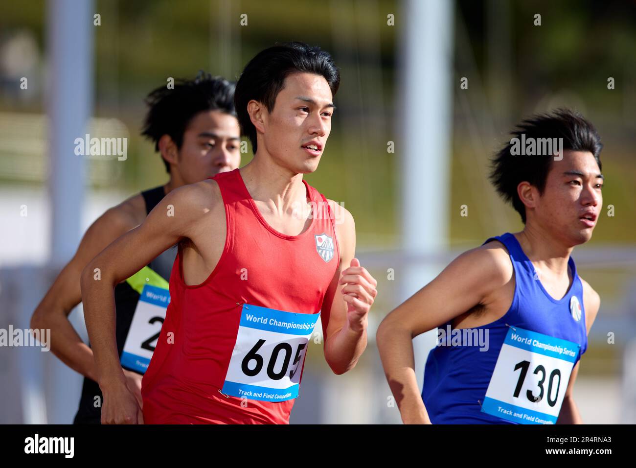 Japanese athletes running on track Stock Photo - Alamy