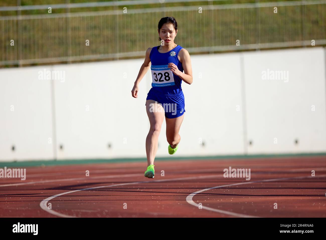 Japanese athletes running on track Stock Photo - Alamy