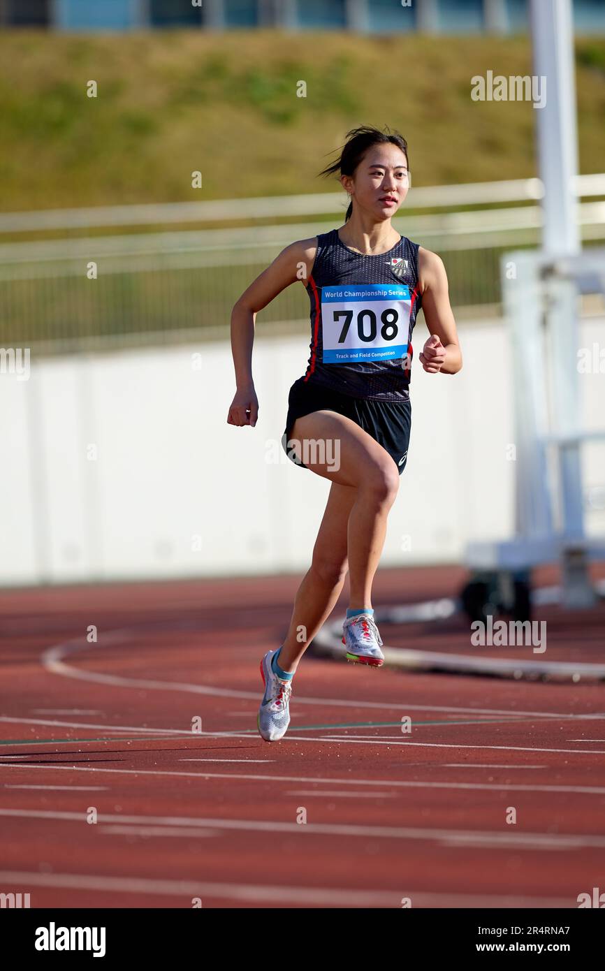 Japanese athletes running on track Stock Photo - Alamy