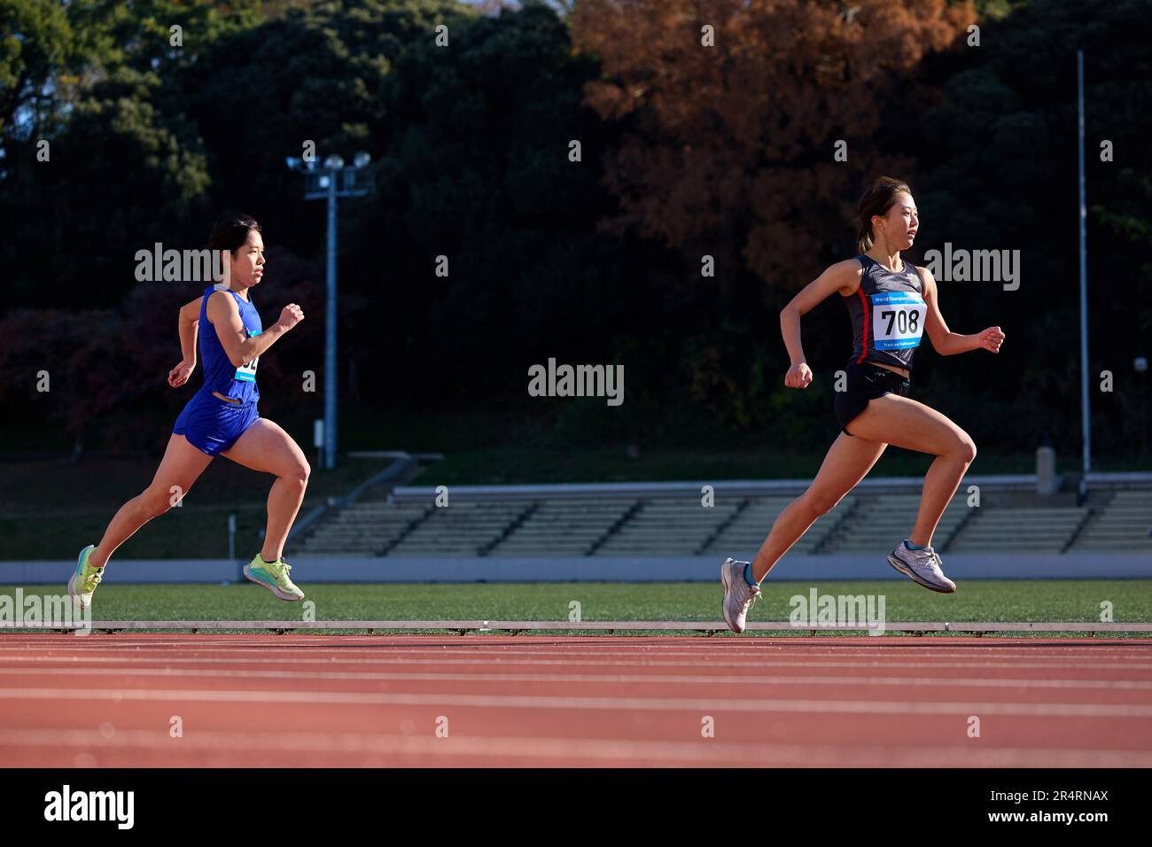 Japanese athletes running on track Stock Photo - Alamy