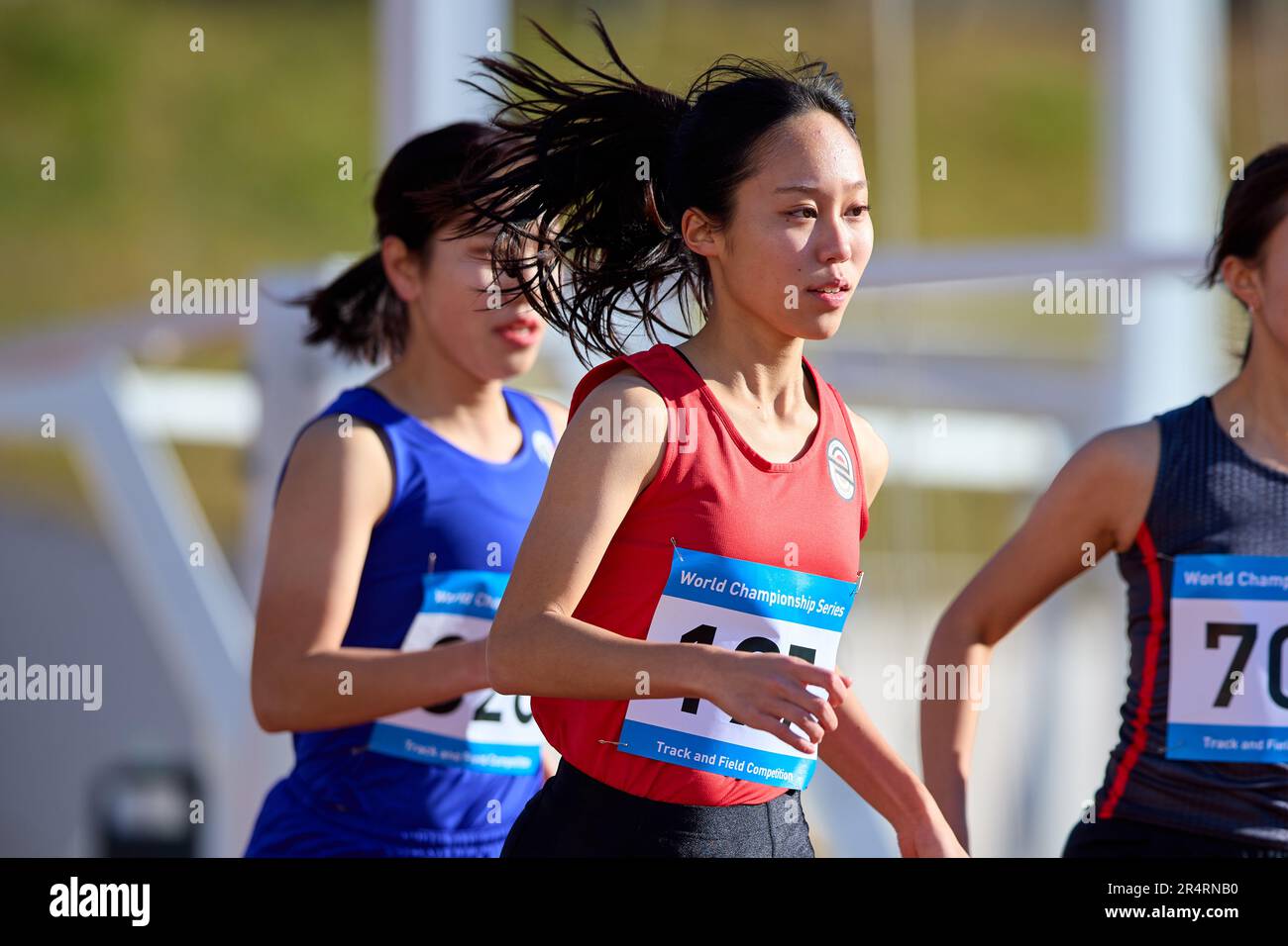 Japanese athletes running on track Stock Photo - Alamy