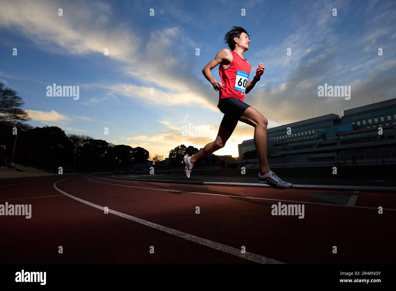 Japanese athletes running on track Stock Photo - Alamy
