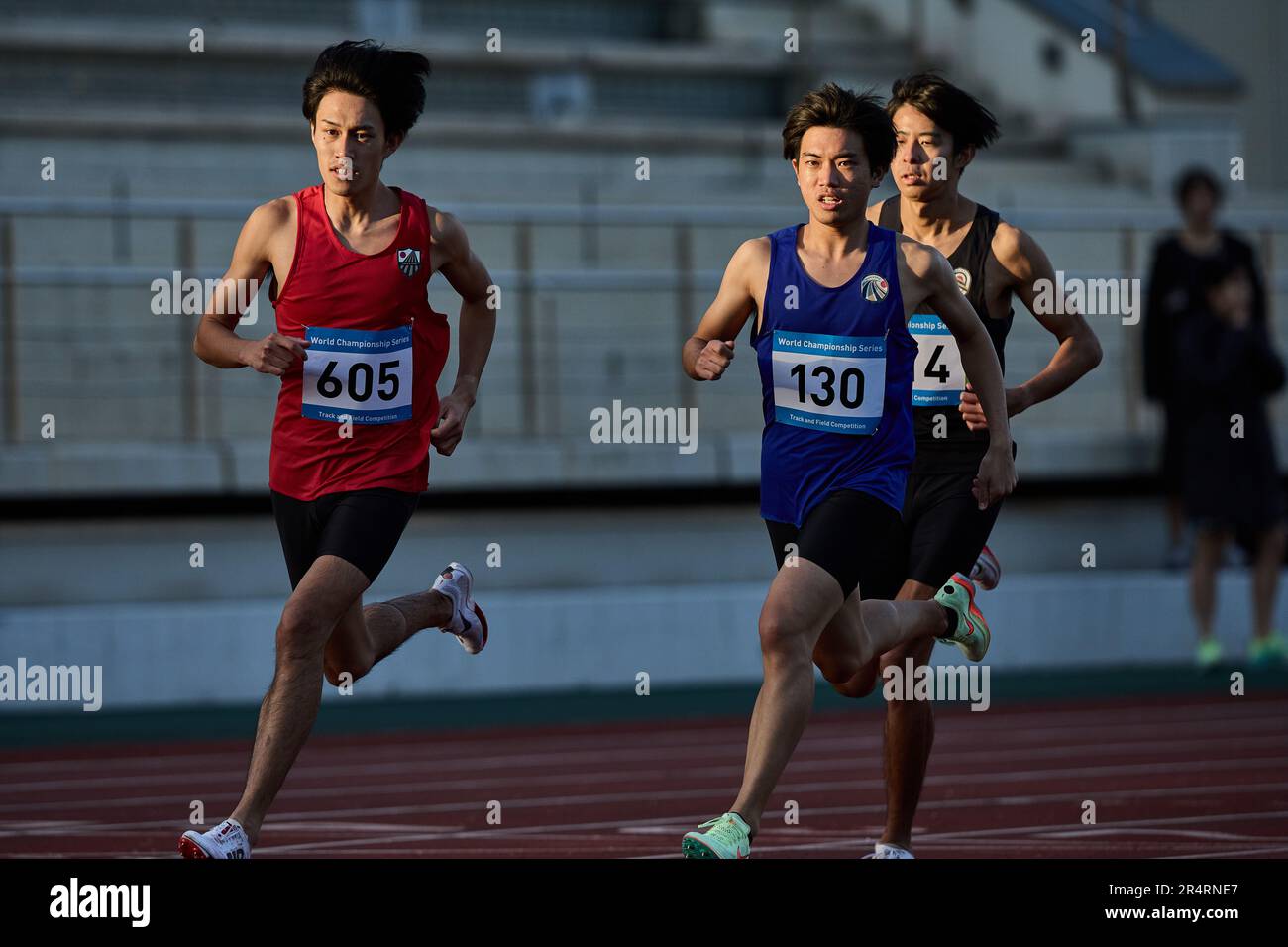Japanese athletes running on track Stock Photo - Alamy