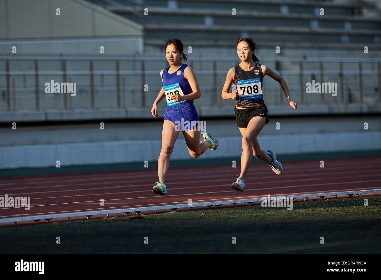 Japanese athletes running on track Stock Photo - Alamy