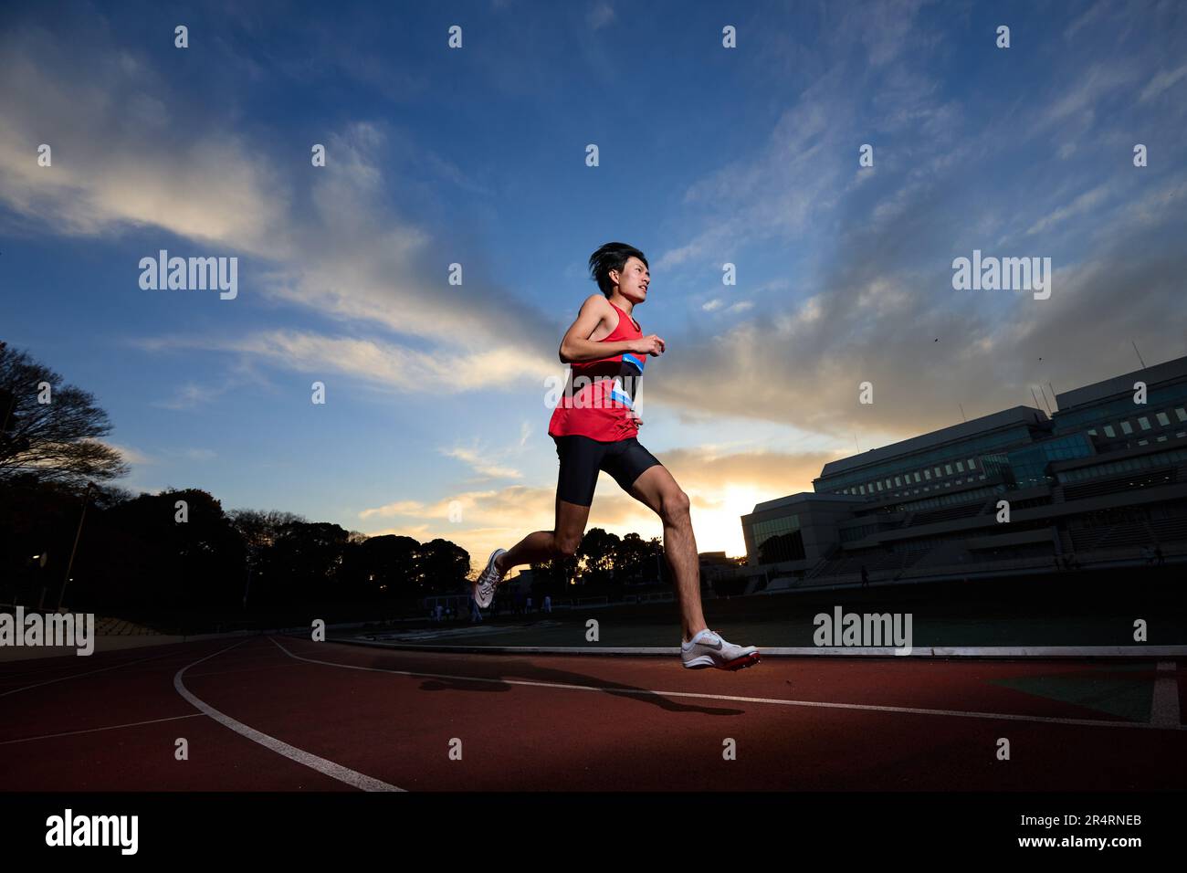Japanese athletes running on track Stock Photo - Alamy