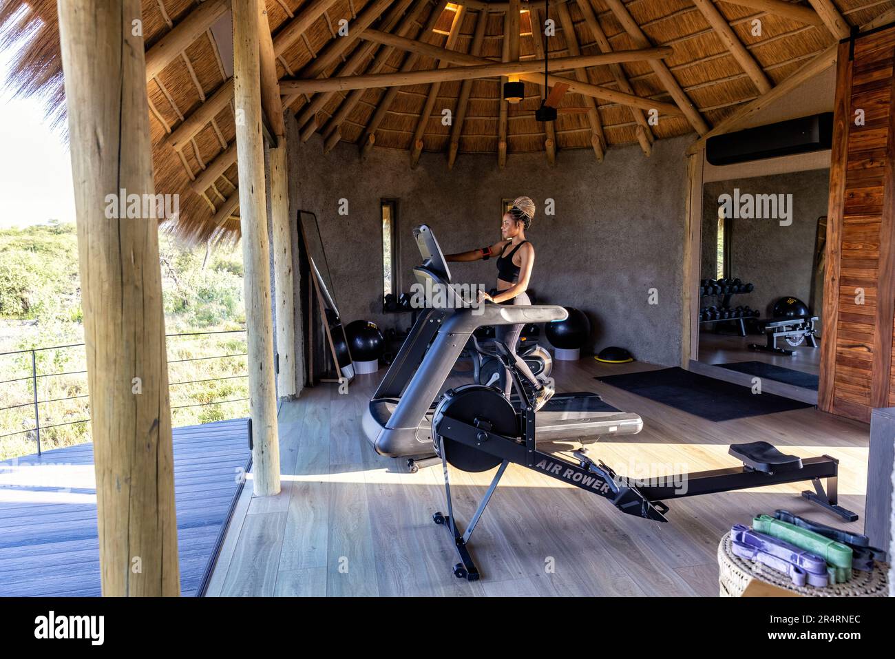 Woman on the treadmill at the gym at Onguma Camp Kala - Onguma Game ...