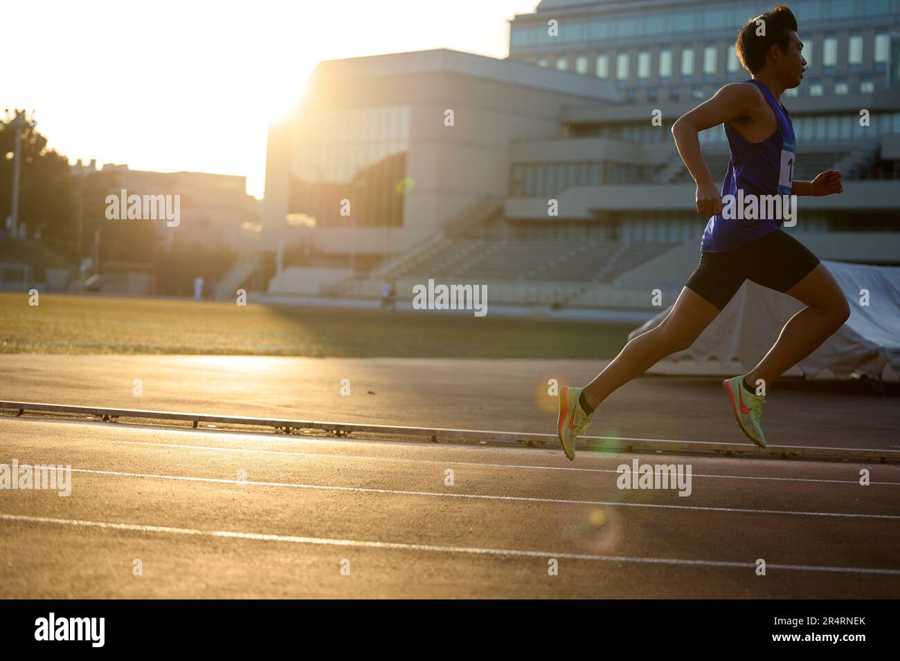 Japanese athletes running on track Stock Photo - Alamy