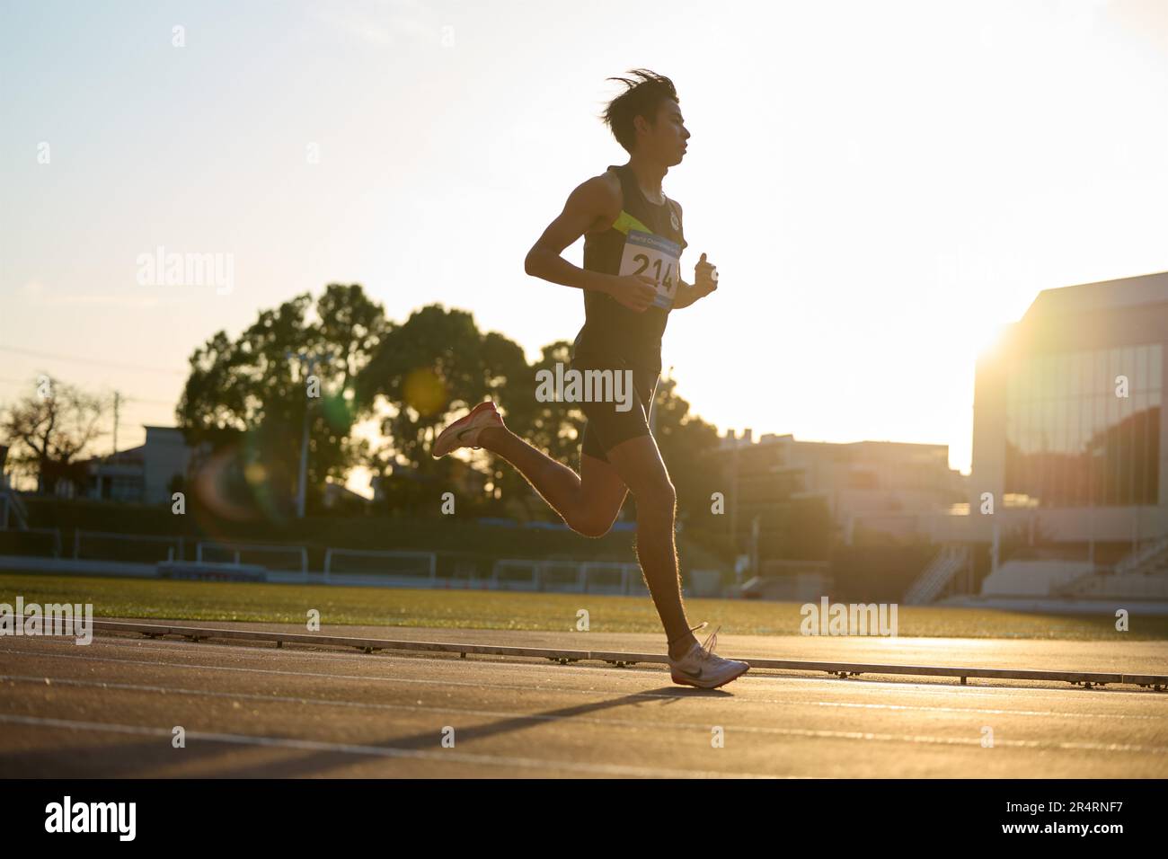 Japanese athletes running on track Stock Photo - Alamy