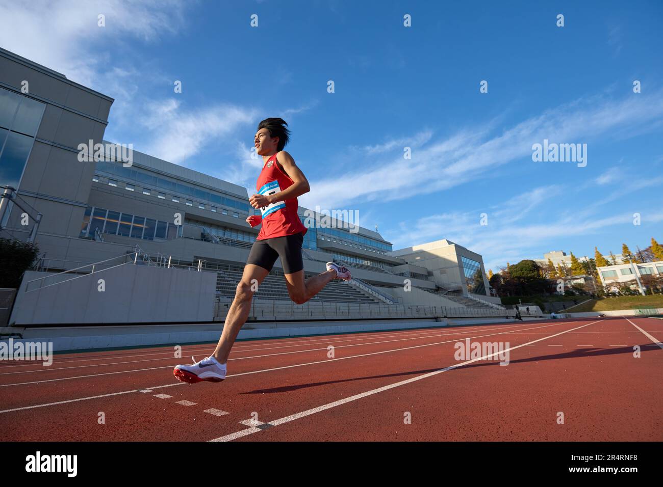 Japanese athletes running on track Stock Photo - Alamy