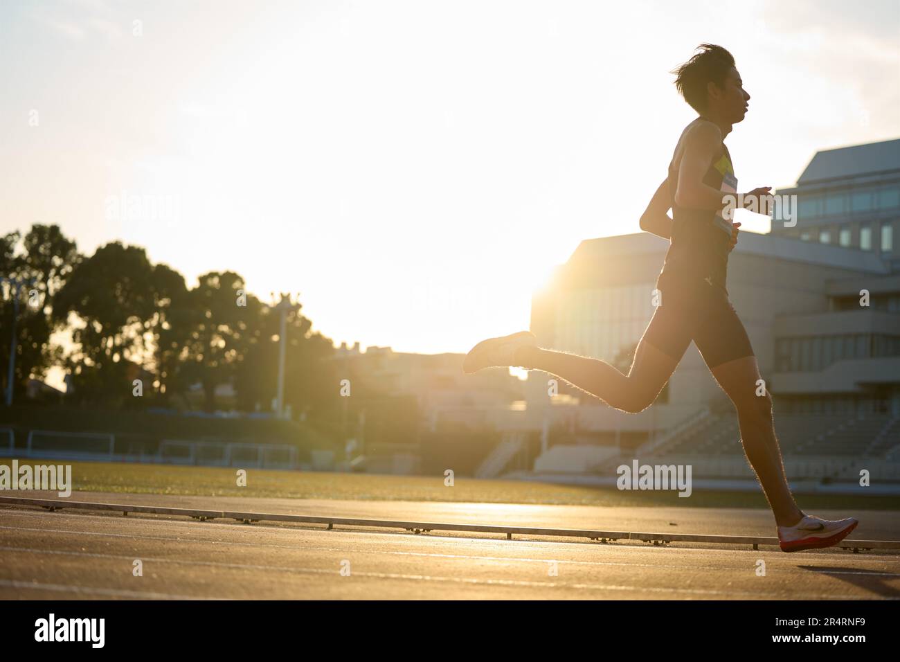 Japanese athletes running on track Stock Photo - Alamy