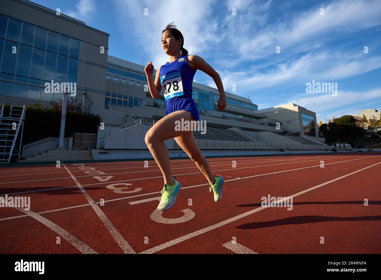 Japanese athletes running on track Stock Photo - Alamy