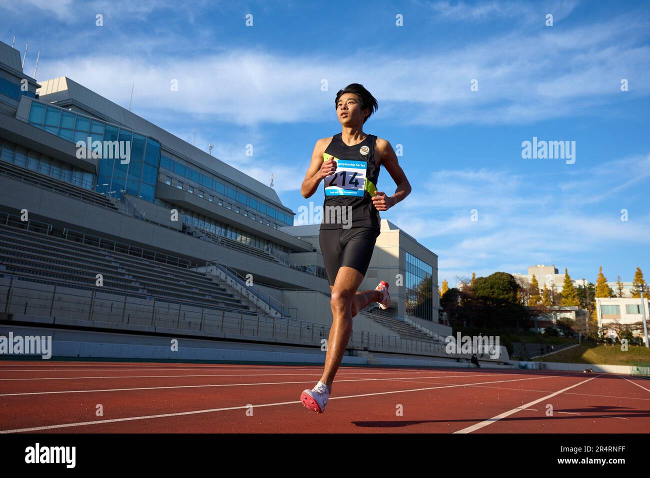 Japanese athletes running on track Stock Photo - Alamy