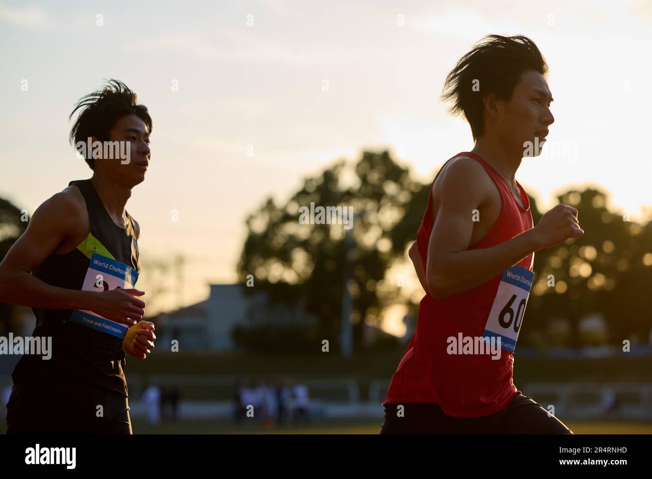 Japanese athletes running on track Stock Photo - Alamy