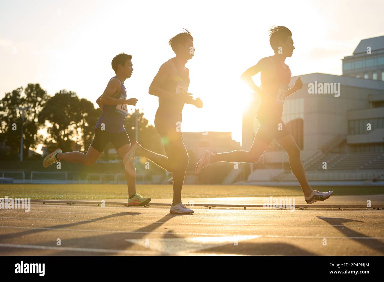 Japanese athletes running on track Stock Photo - Alamy
