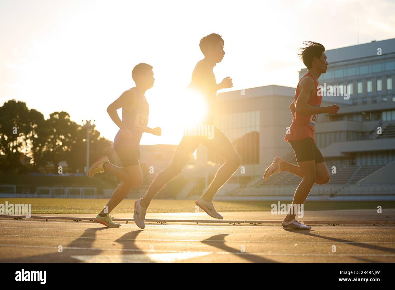 Japanese athletes running on track Stock Photo - Alamy