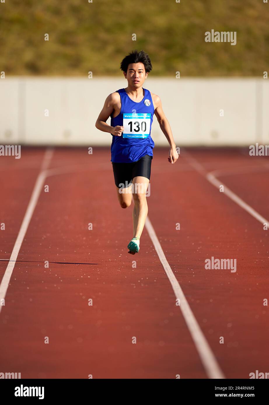 Japanese athletes running on track Stock Photo - Alamy