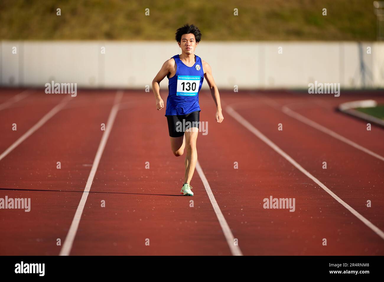 Japanese athletes running on track Stock Photo - Alamy