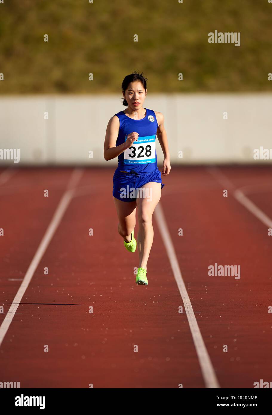 Japanese athletes running on track Stock Photo - Alamy