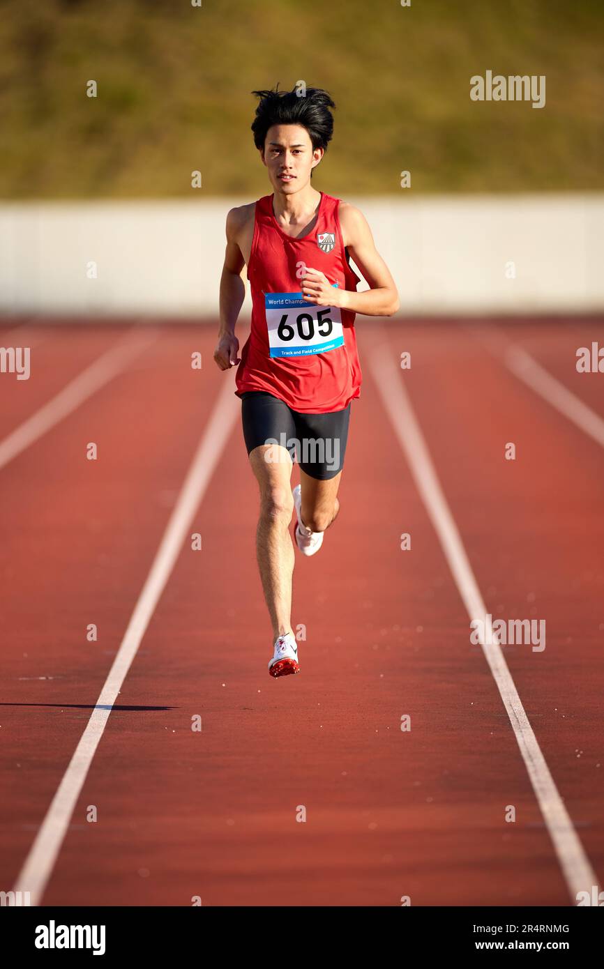 Japanese athletes running on track Stock Photo - Alamy