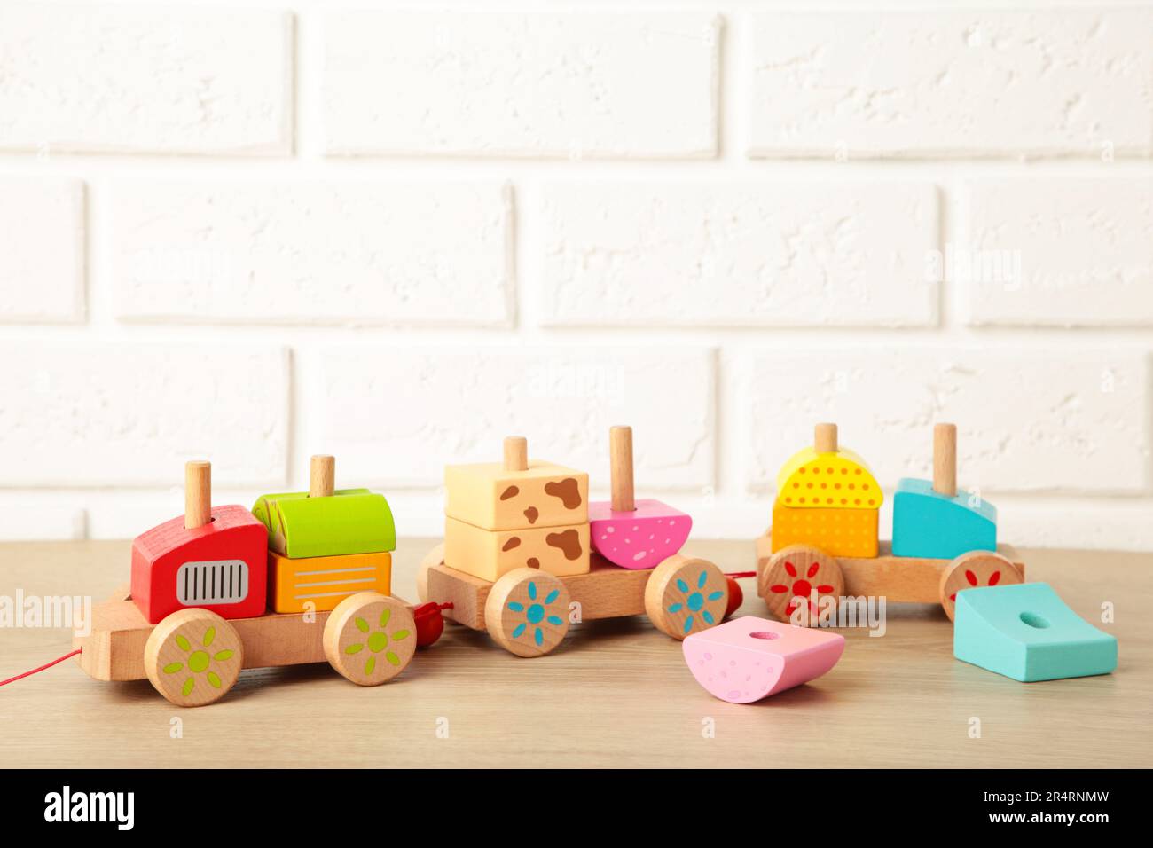 Stacking train toddler toy for little children on light background with ...