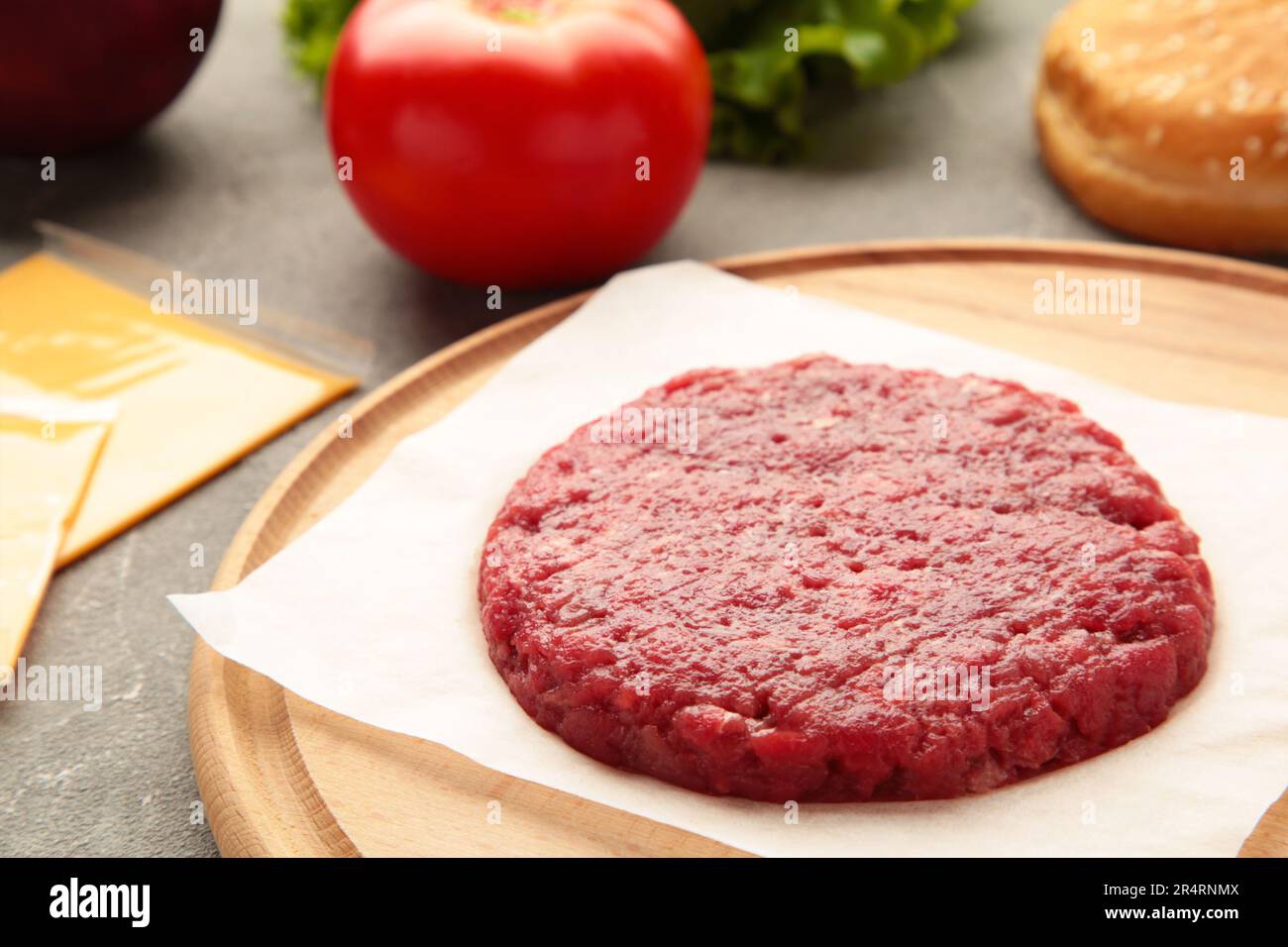 Raw Ground beef meat Burger steak cutlets on wooden table. Top view ...