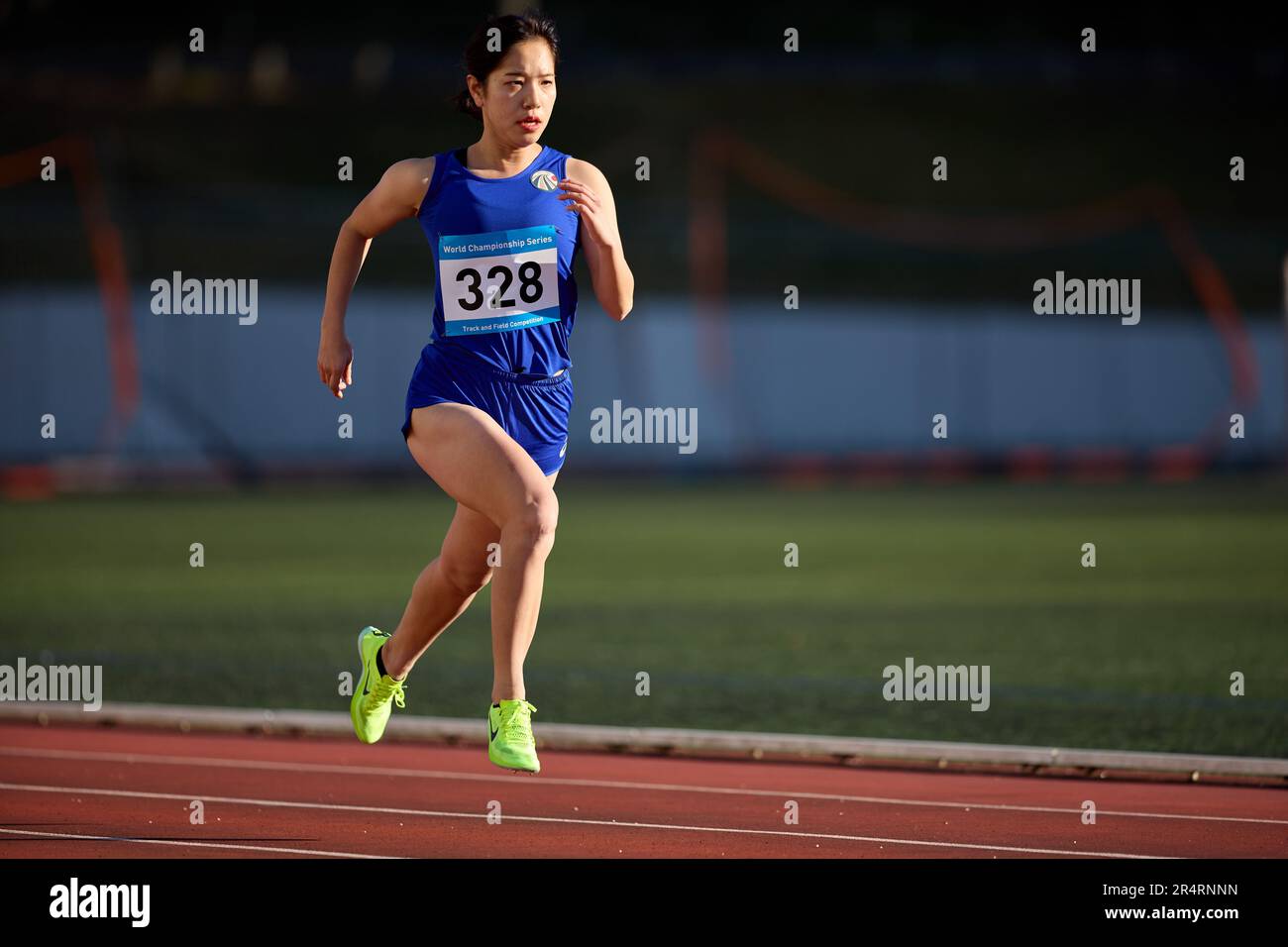 Japanese athletes running on track Stock Photo - Alamy