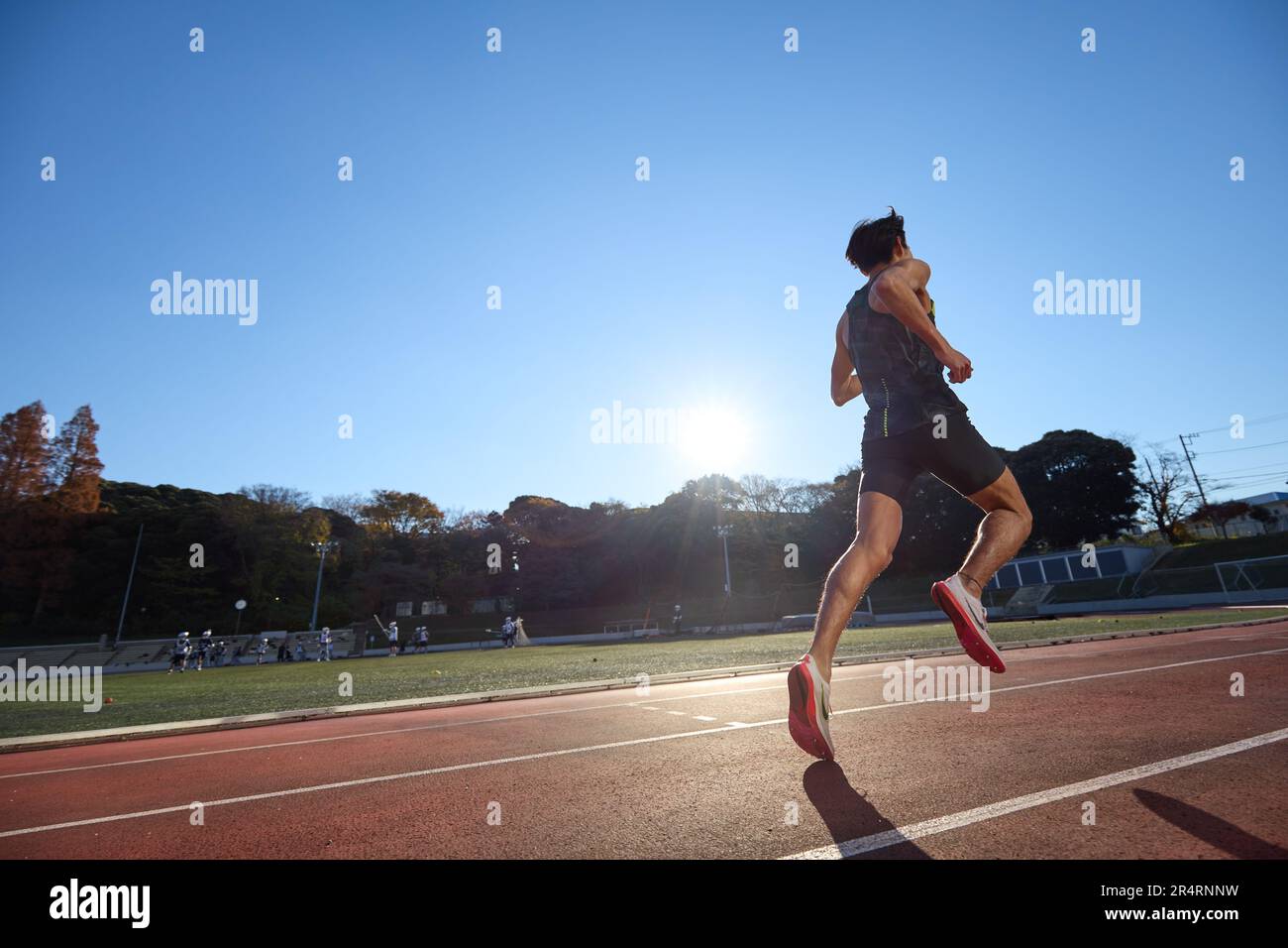 Japanese athletes running on track Stock Photo - Alamy