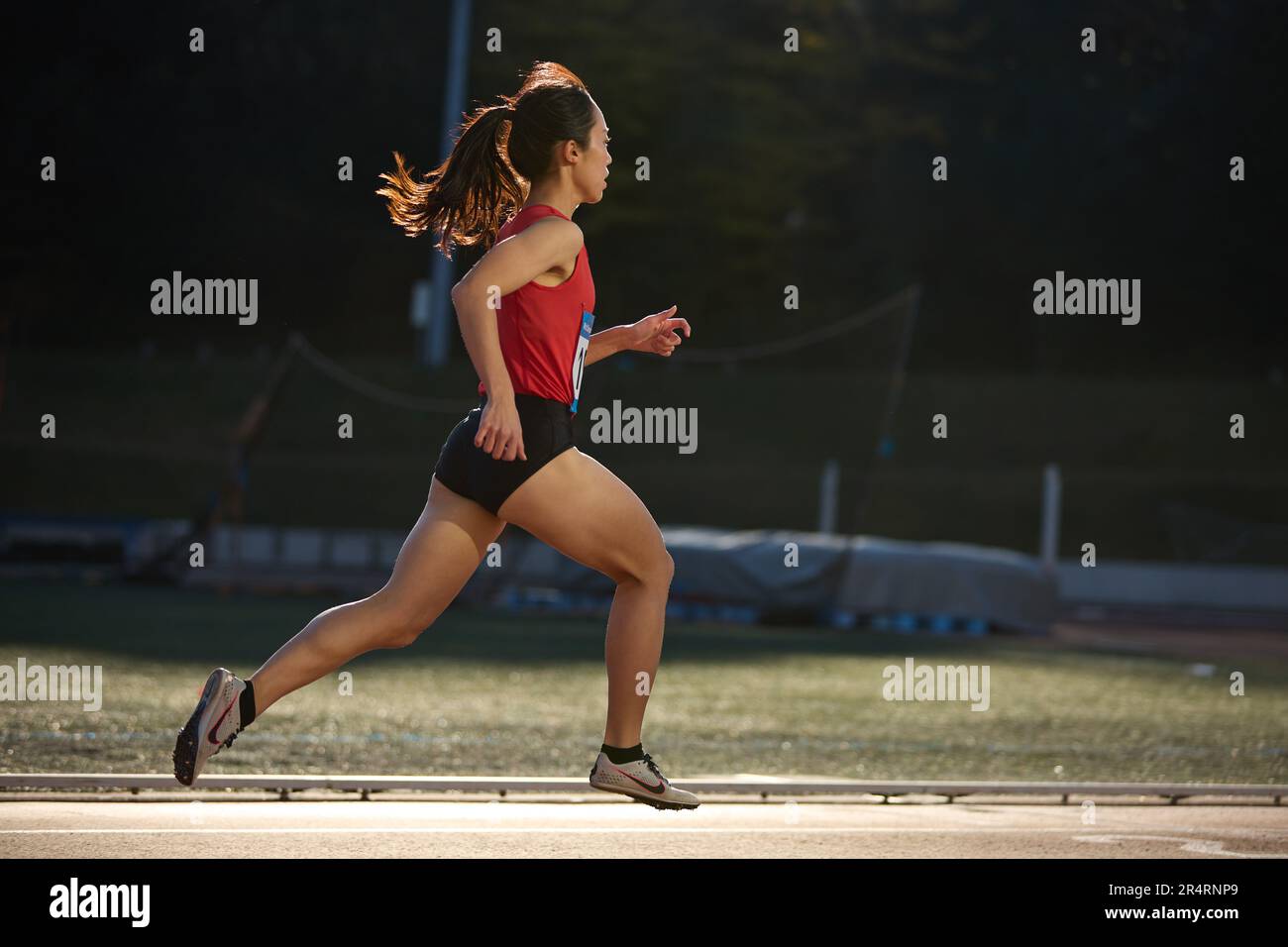 Japanese athletes running on track Stock Photo - Alamy