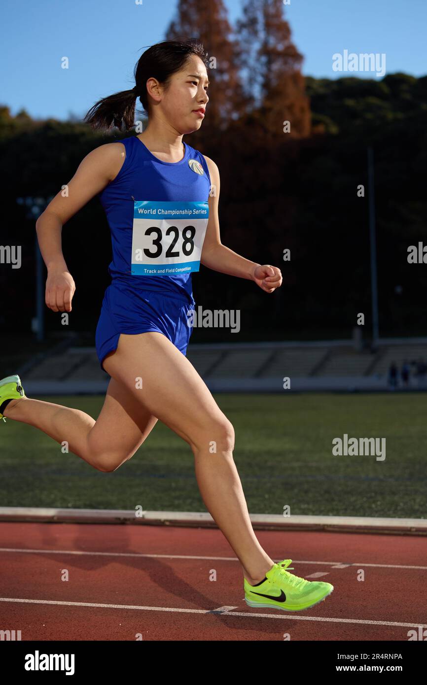 Japanese athletes running on track Stock Photo - Alamy