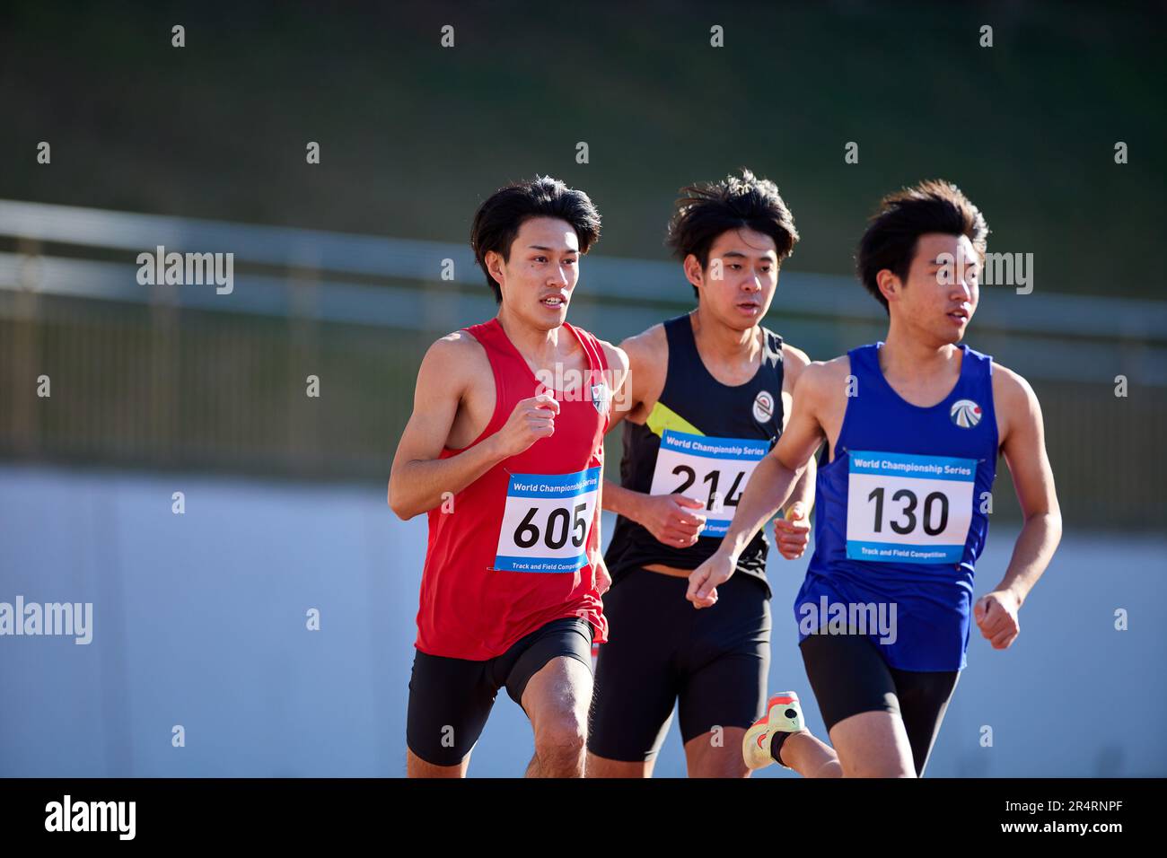 Japanese athletes running on track Stock Photo - Alamy