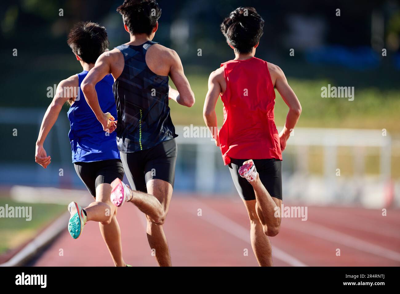 Japanese athletes running on track Stock Photo - Alamy