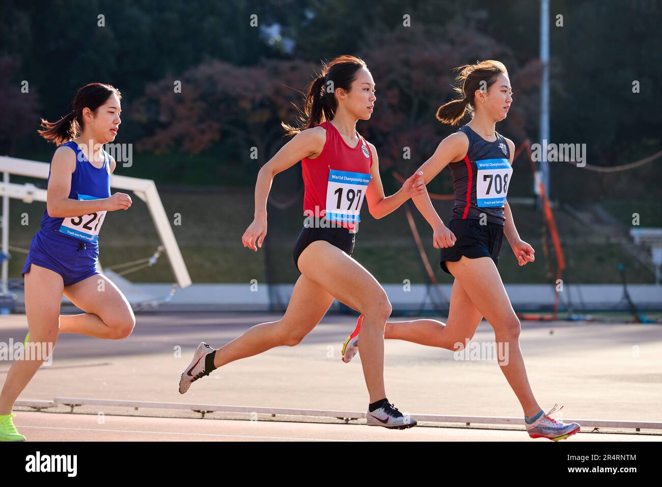 Japanese athletes running on track Stock Photo - Alamy