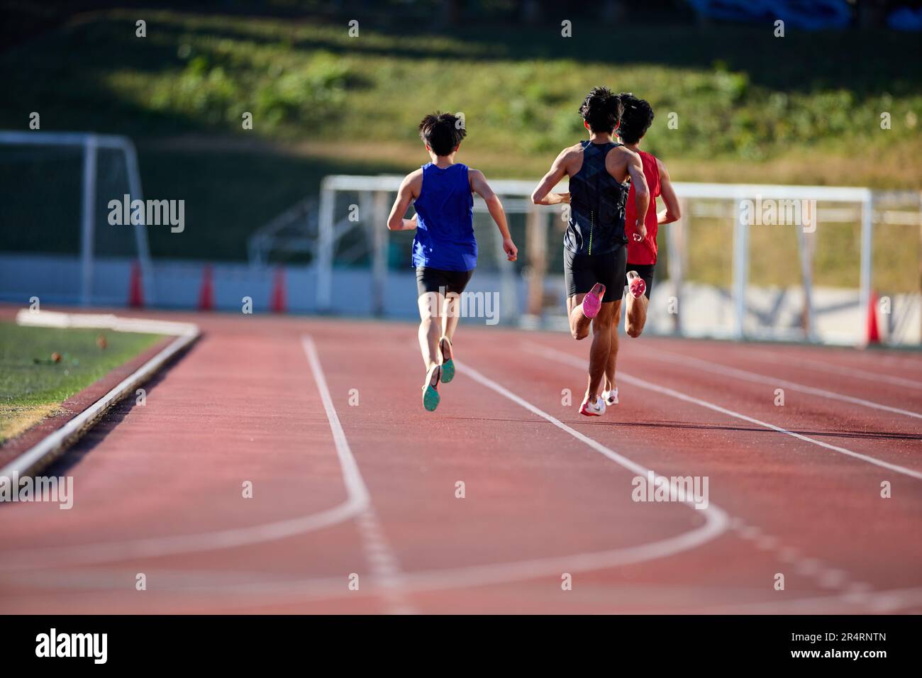 Japanese athletes running on track Stock Photo - Alamy