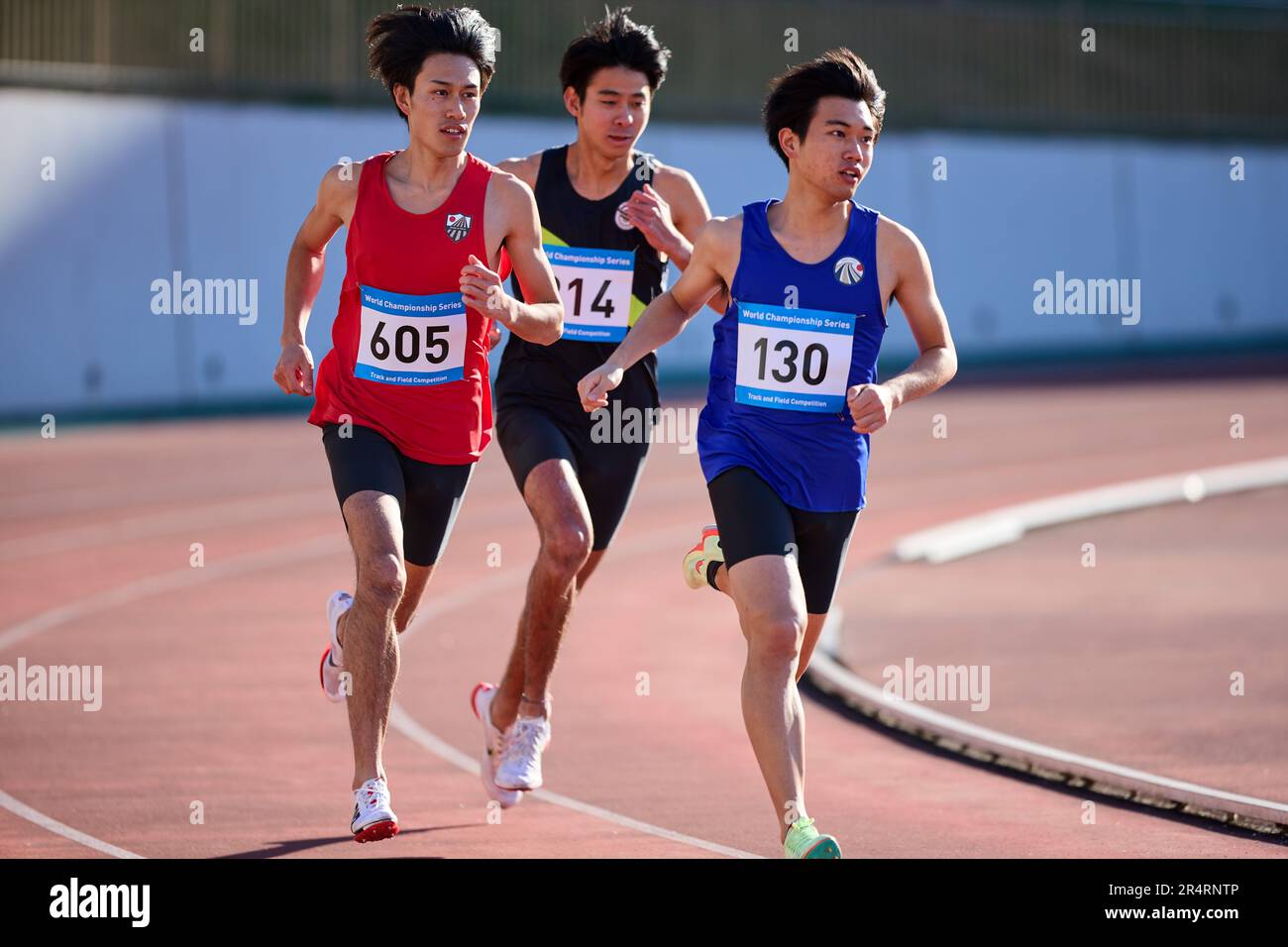 Japanese athletes running on track Stock Photo - Alamy
