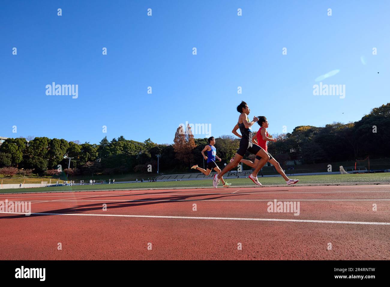 Japanese athletes running on track Stock Photo - Alamy