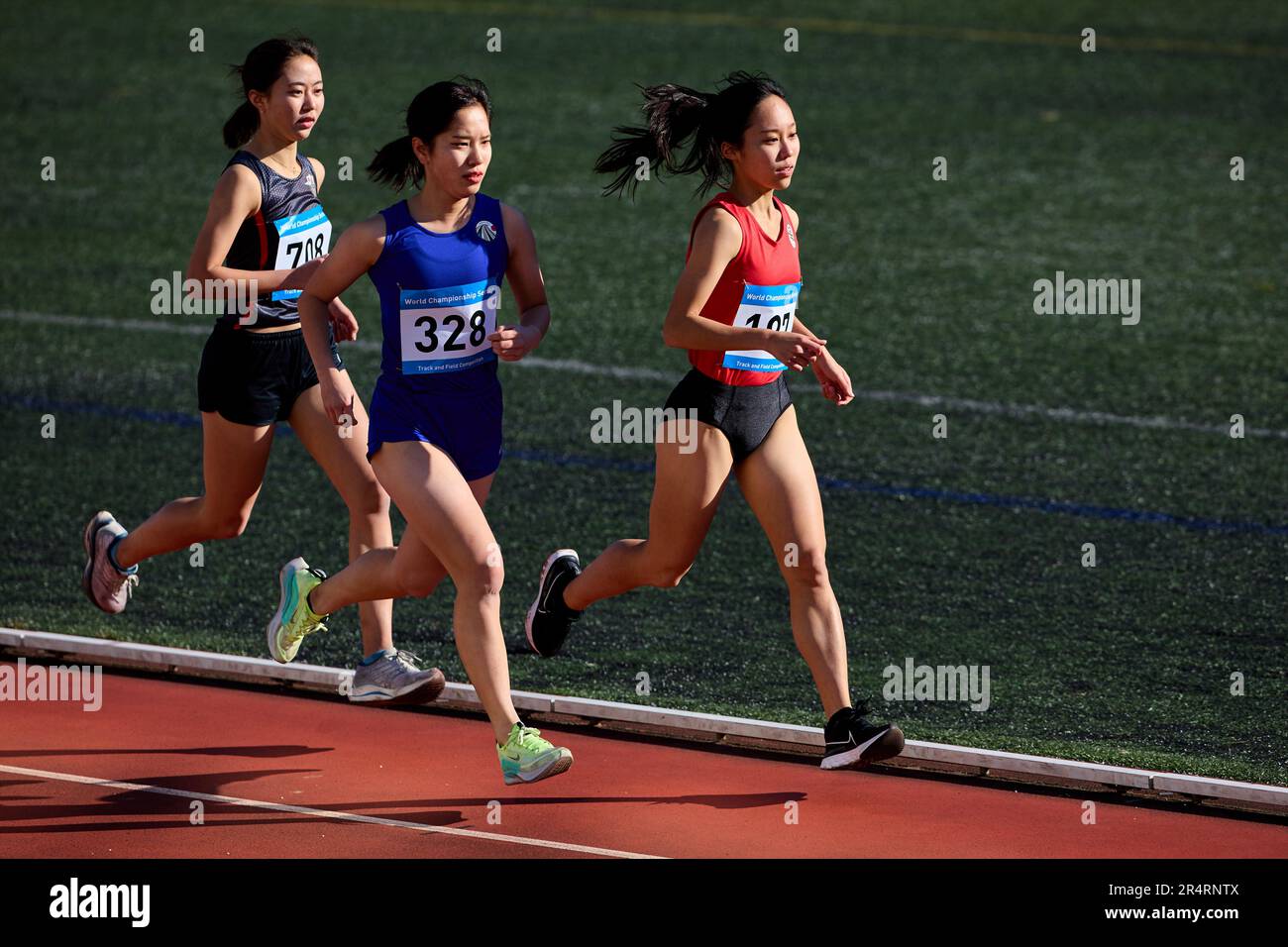 Japanese athletes running on track Stock Photo - Alamy