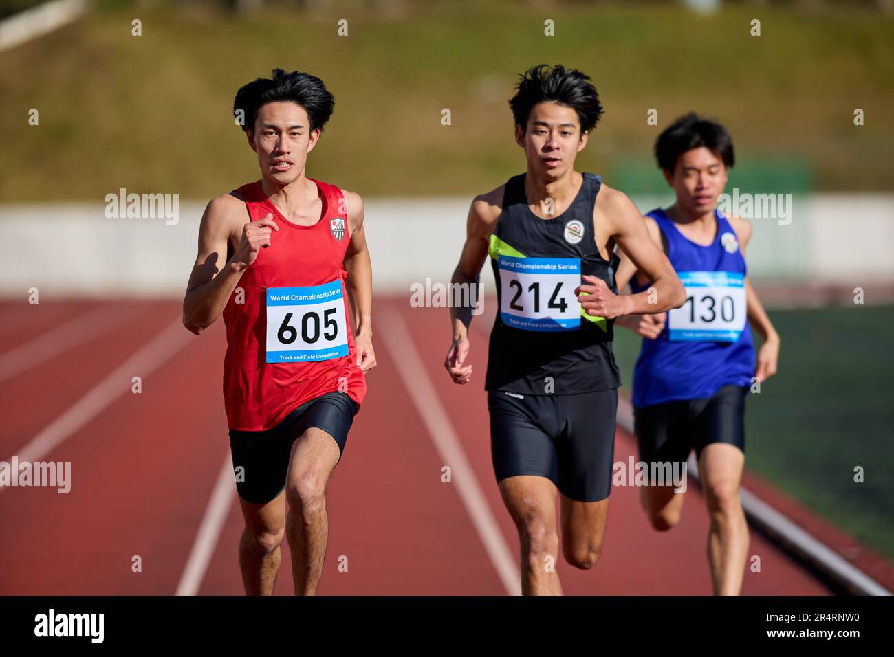Japanese athletes running on track Stock Photo - Alamy