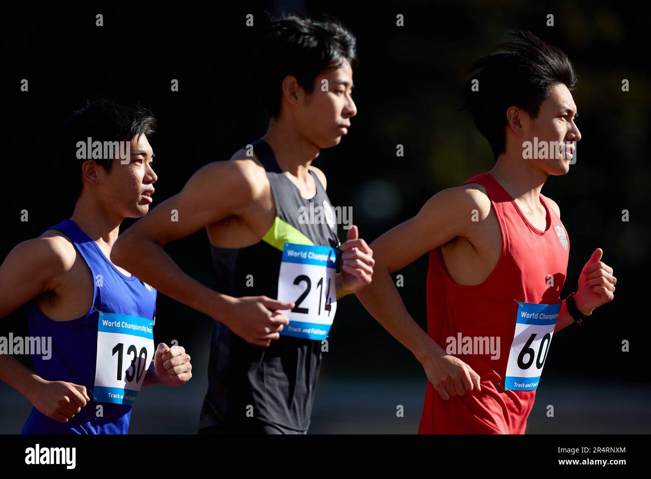 Japanese athletes running on track Stock Photo - Alamy