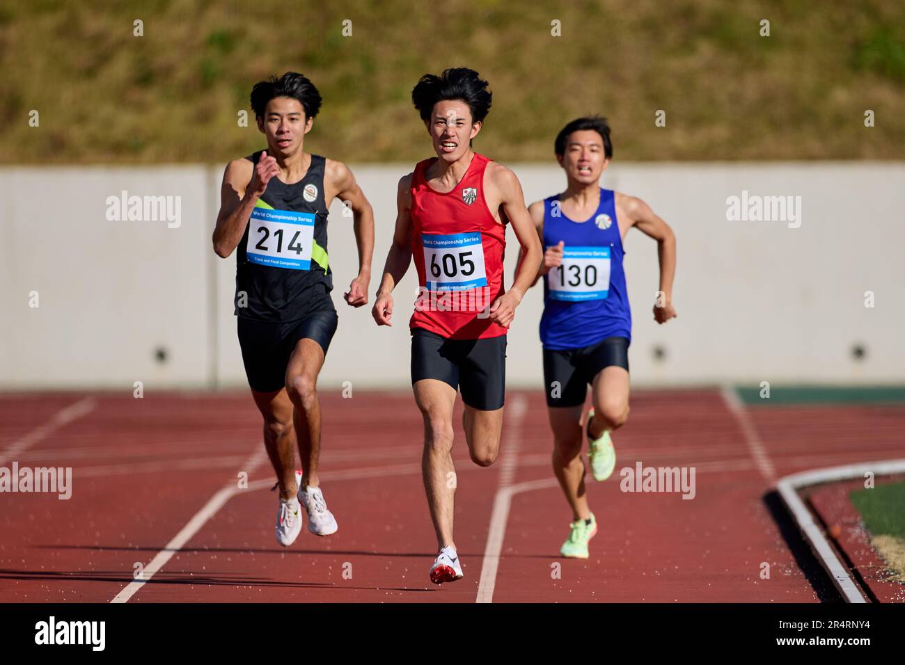 Japanese athletes running on track Stock Photo - Alamy