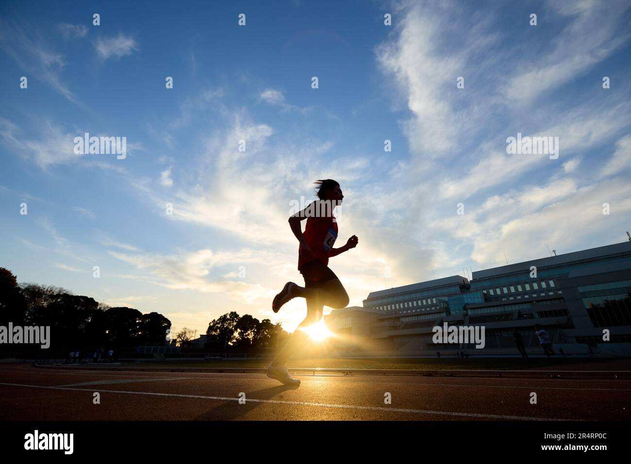 Japanese athletes running on track Stock Photo - Alamy